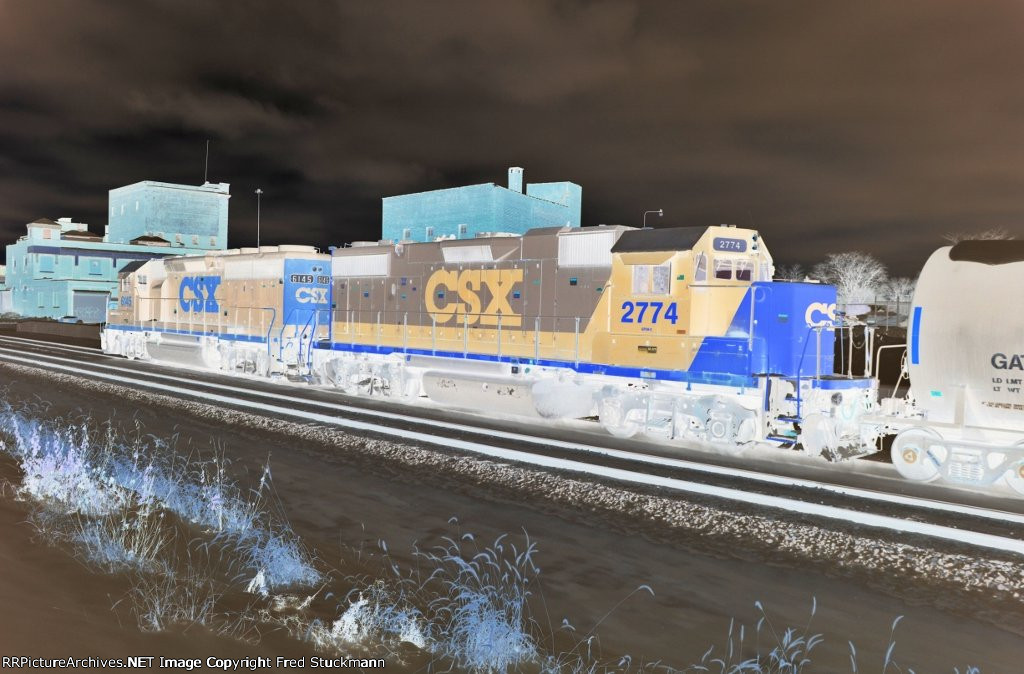 CSX 2774 Tags along behind 6145.